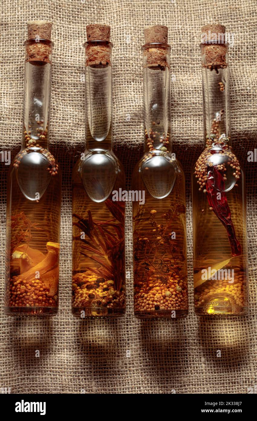 Homemade olive oil with herbs and spices in small bottles Stock Photo ...