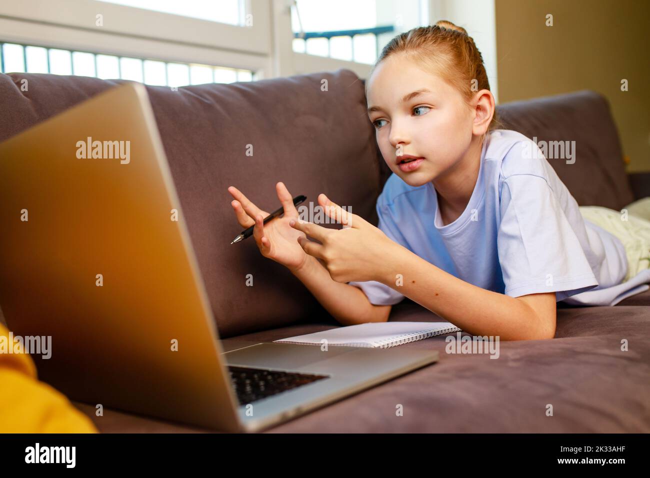 blonge hair little girl using a laptop,doing homework at home.Back to ...