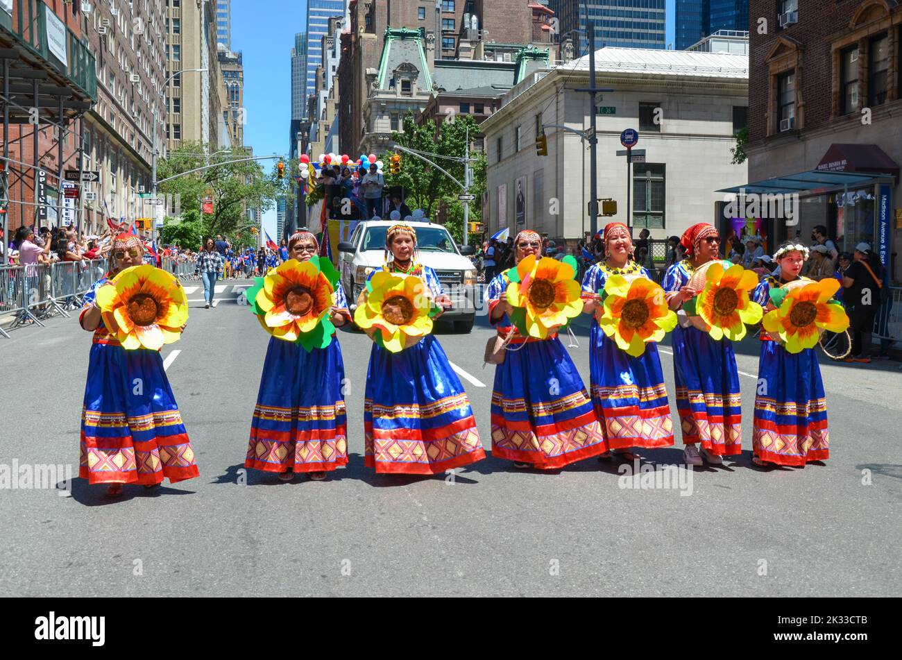 The participants in traditional Filipino outfits marching in the ...