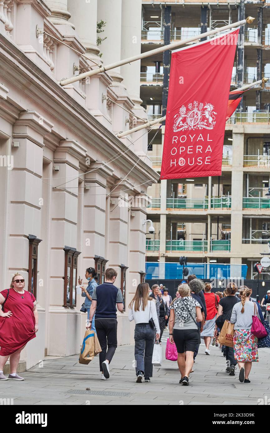 Shoppers pass under the flag outside the main entrance to the Royal ...