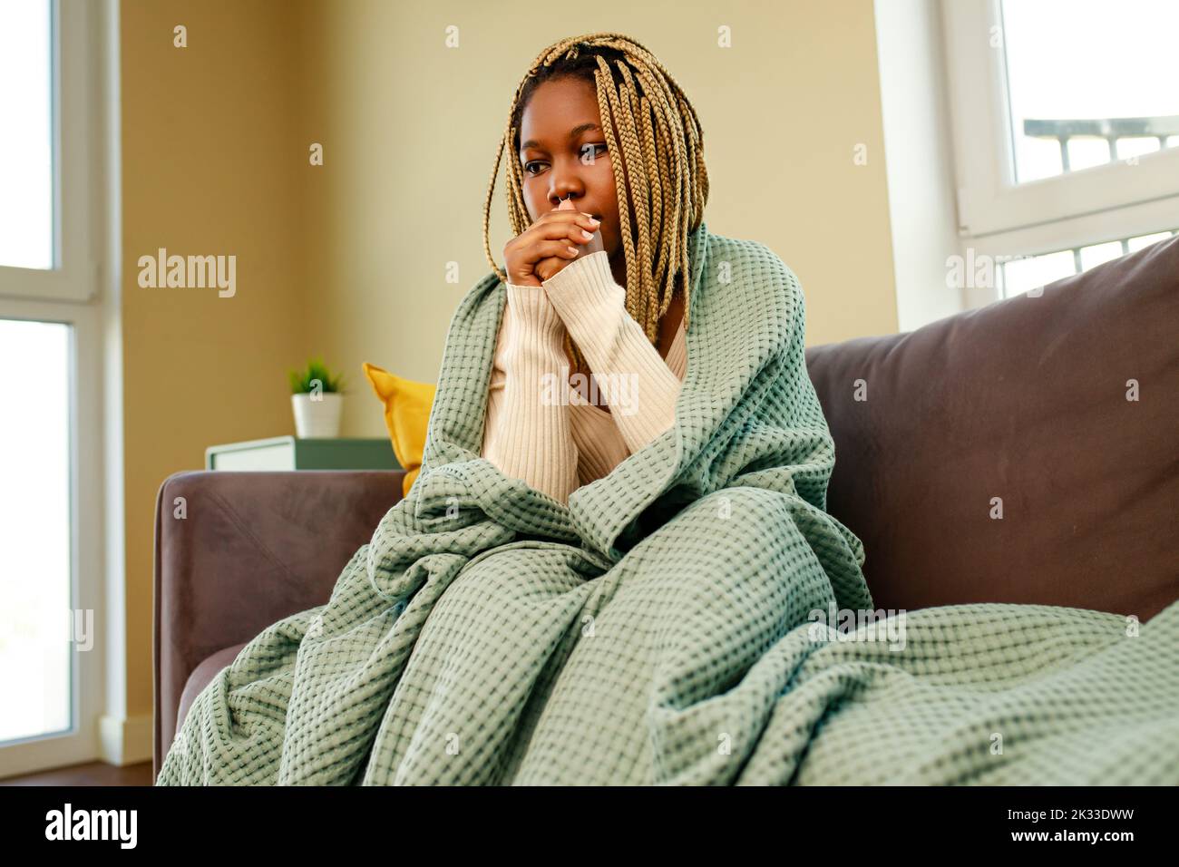 Person wrapped in blanket at home hi-res stock photography and images ...