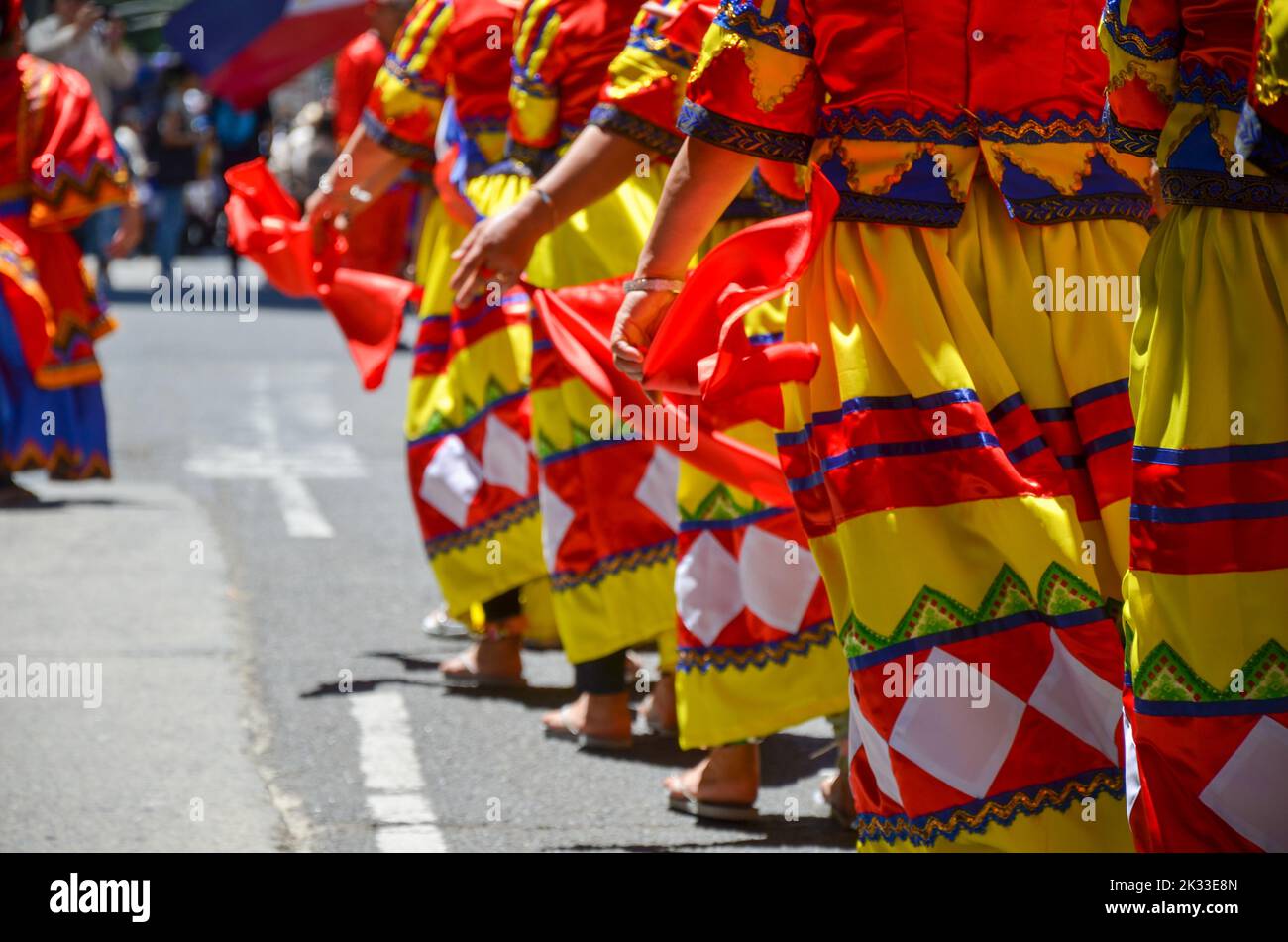 The participants in traditional Filipino outfits marching in the ...