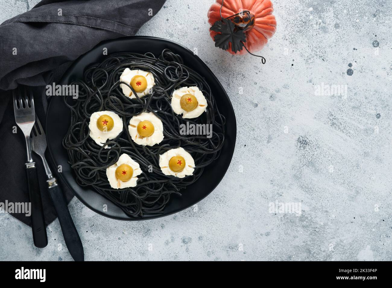 Halloween party Italian black pasta decorated horror olives like eyes ...