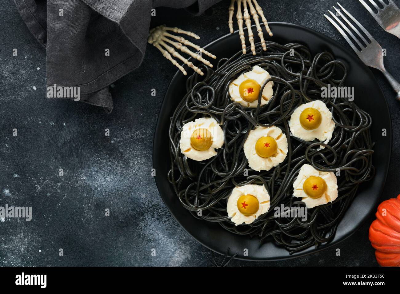 Halloween party Italian black pasta decorated horror olives like eyes ...