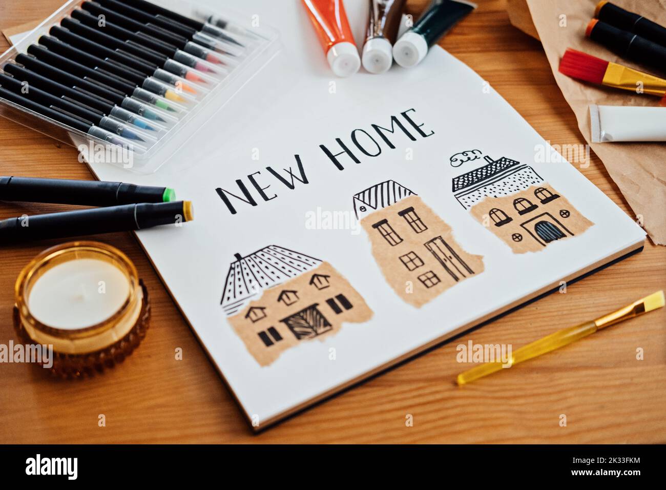 Dreaming about new house. Drawing of several houses text new home on ...