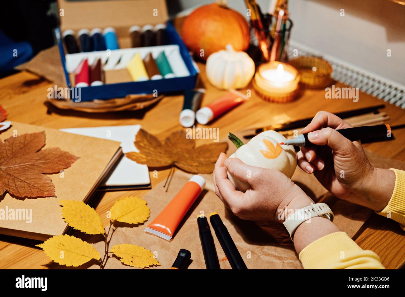Autumn pumpkins craft. DIY Fall Crafts for Adults. Female hands draw ...