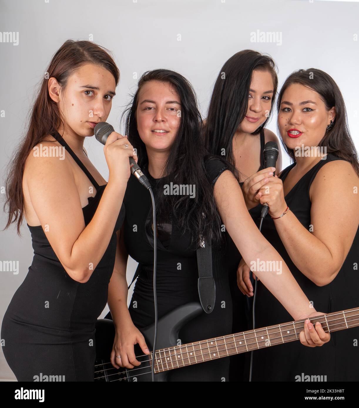 Female music group on isolated white background Stock Photo - Alamy