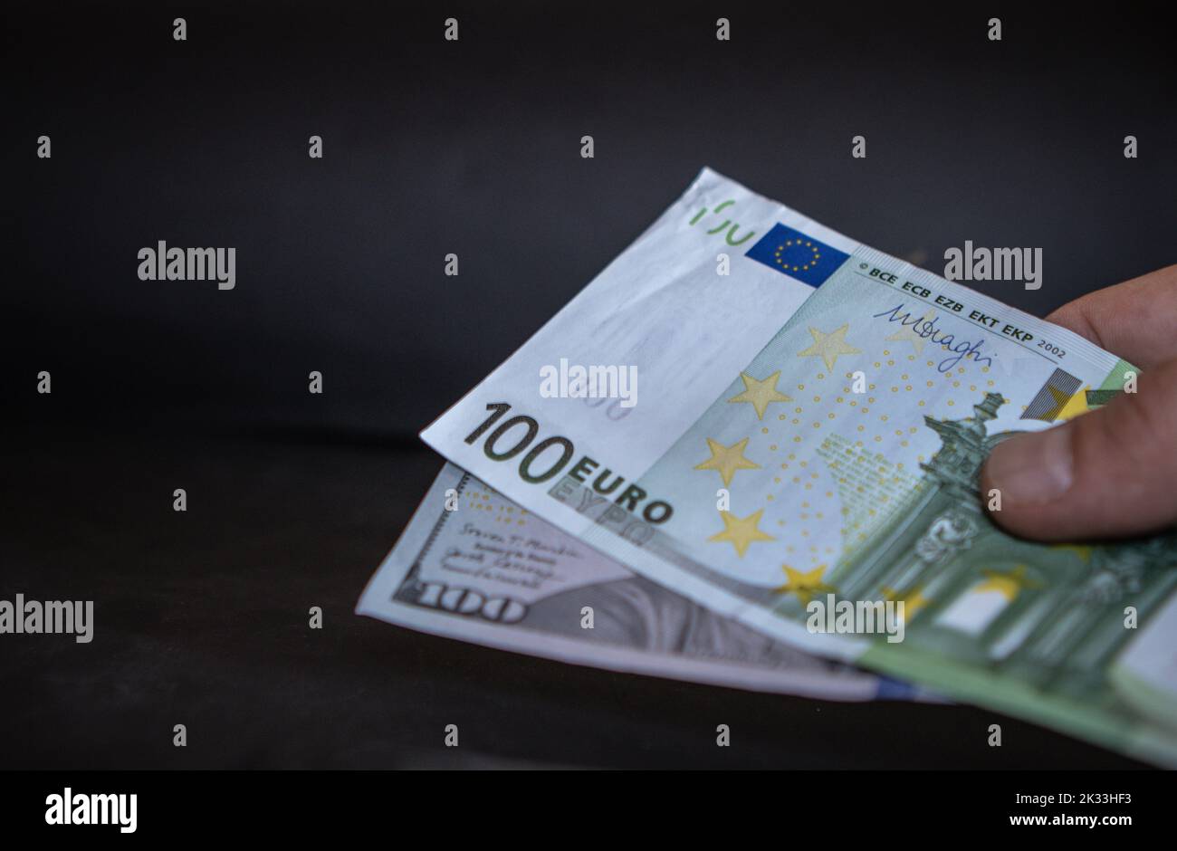 Holds stack of 100 dollar and 100 euro hi-res stock photography and ...