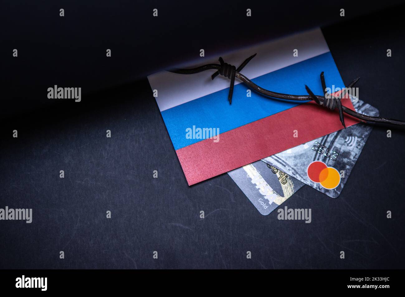 Russian Flag and Master and Visa cards with Barbed Wire, sanctions on ...