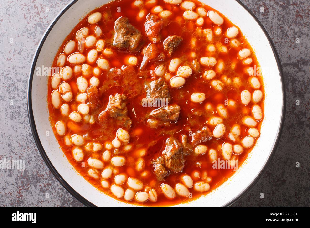 Turkish white bean stew with meat Etli kuru fasulye closeup in the ...