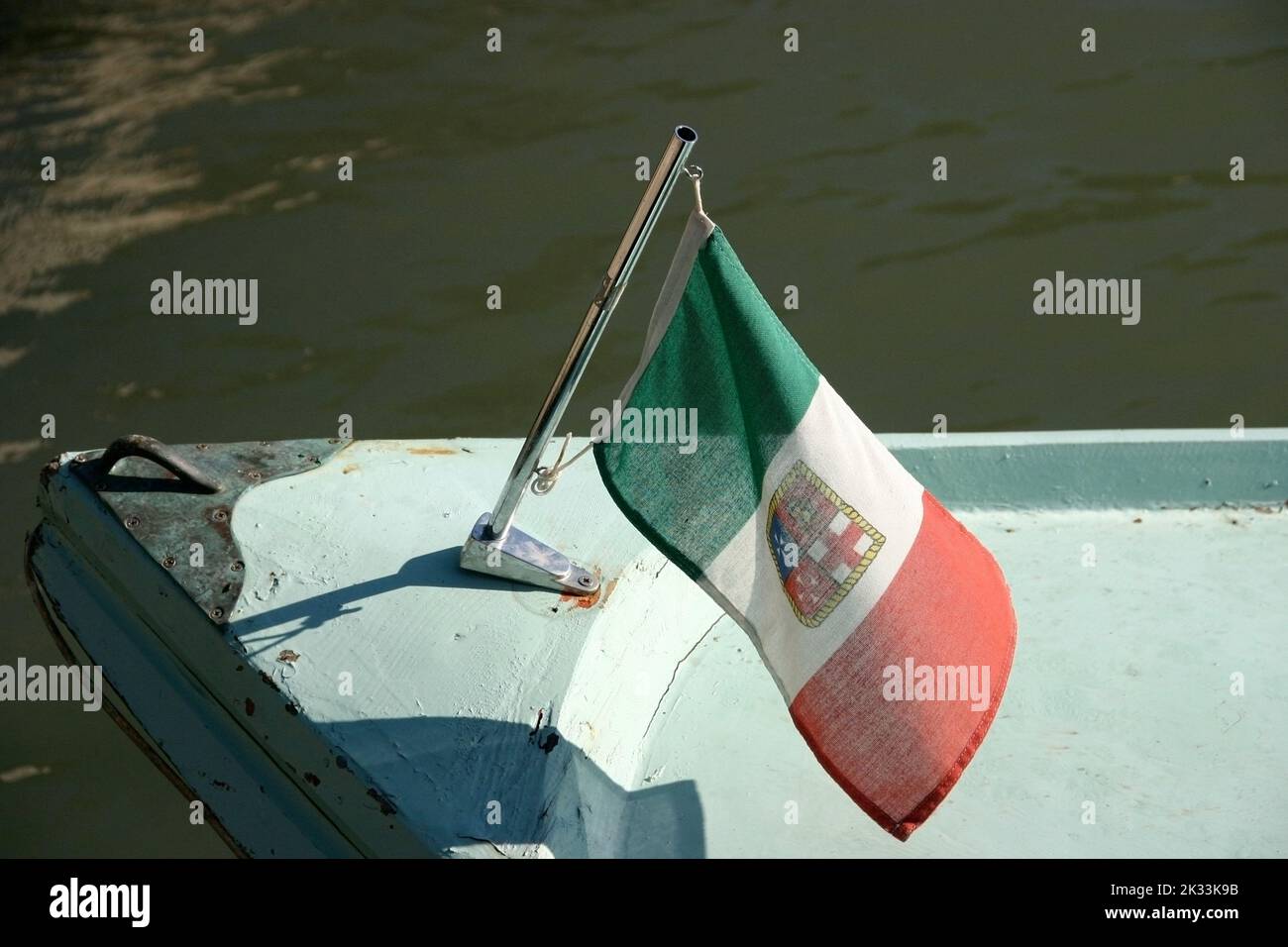 The Italian maritime flag waving in the wind, attached to the end of a ...