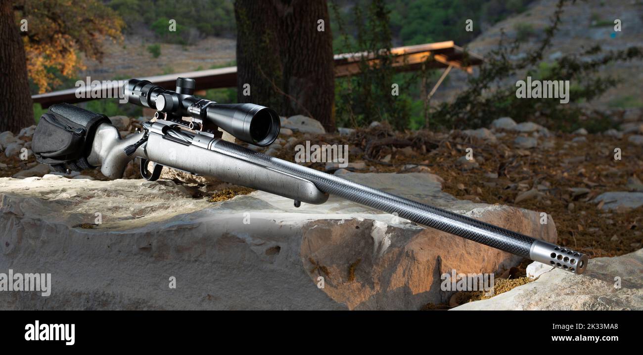 Bolt action rifle with a muzzle brake on its barrel Stock Photo - Alamy