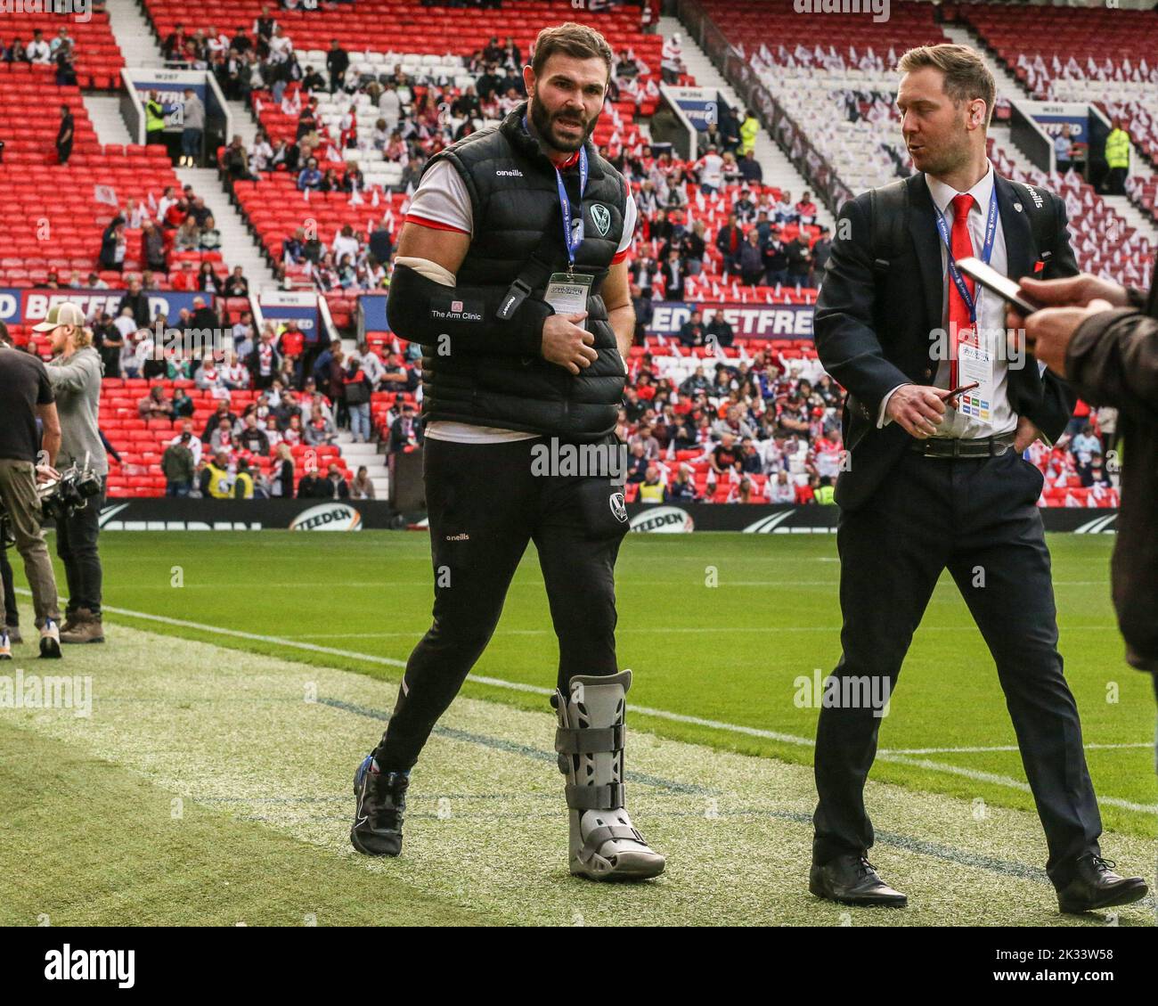 Alex Walmsley #8 of St Helens on his way to be interviewed for channel ...