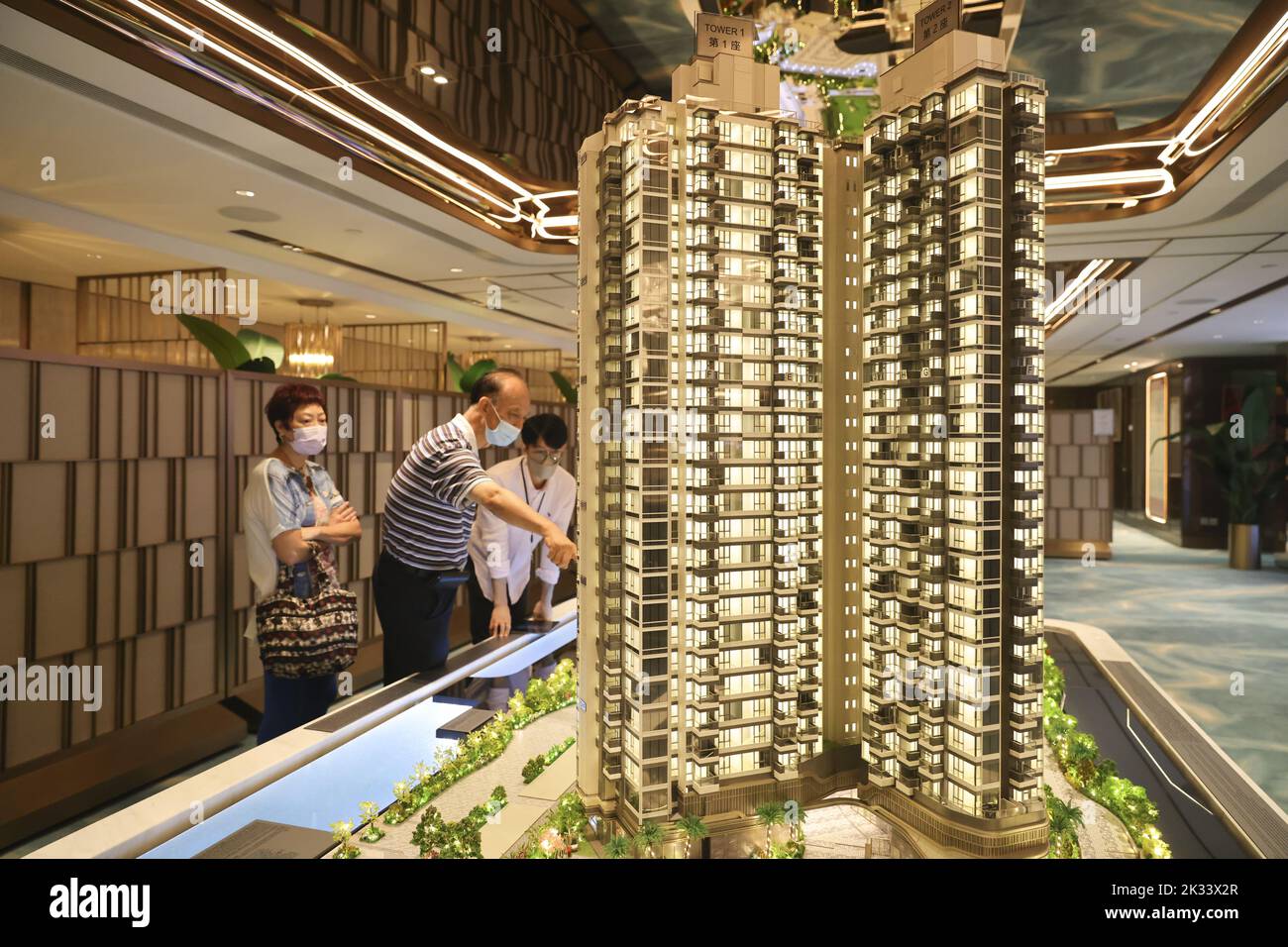 Potential buyers look at a model of Miami Quay which developer Wheelock Properties will sell 139 ...