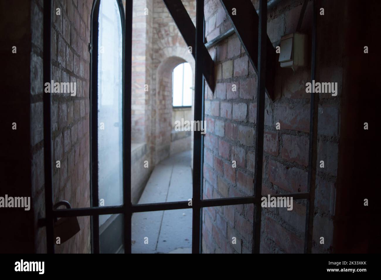 Locked barred steel gate, entrance to secret passage Stock Photo - Alamy
