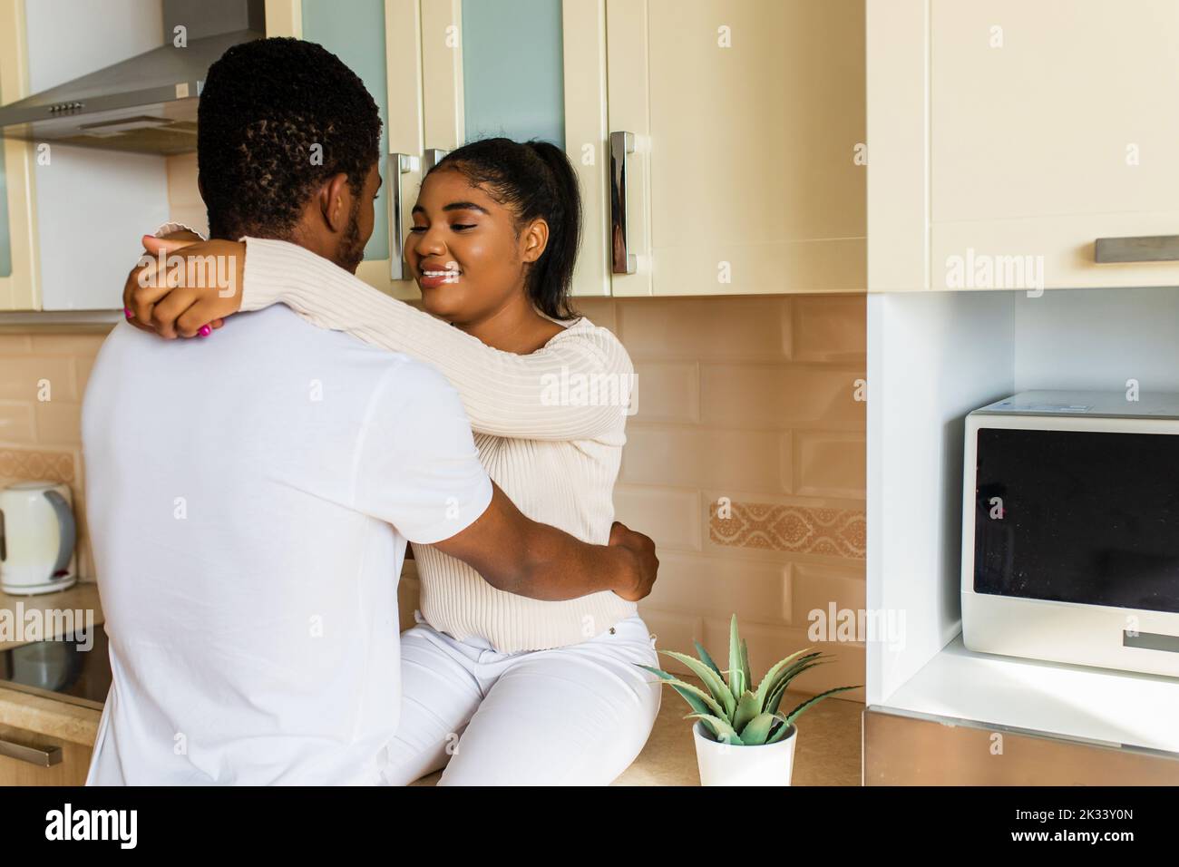 Young Happy Mixed Race Couple Spending Their Time At Home In The