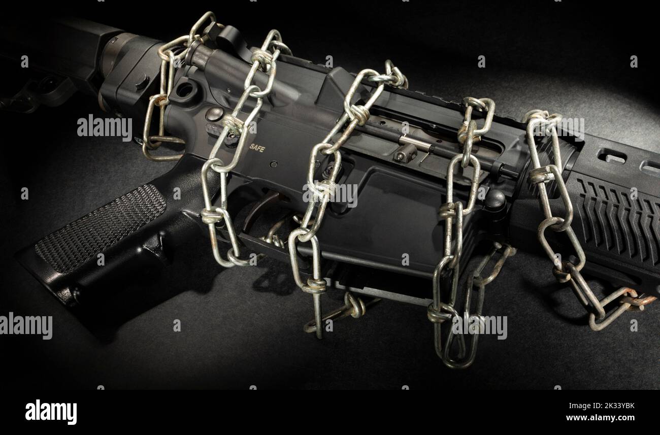 AR-15 with chain wrapped around to keep it safe Stock Photo - Alamy