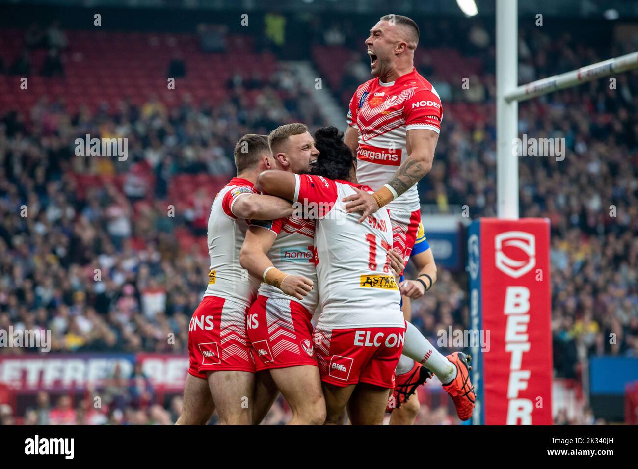 Matty Lees #10 of St Helens celebrates his try with his team mates and ...