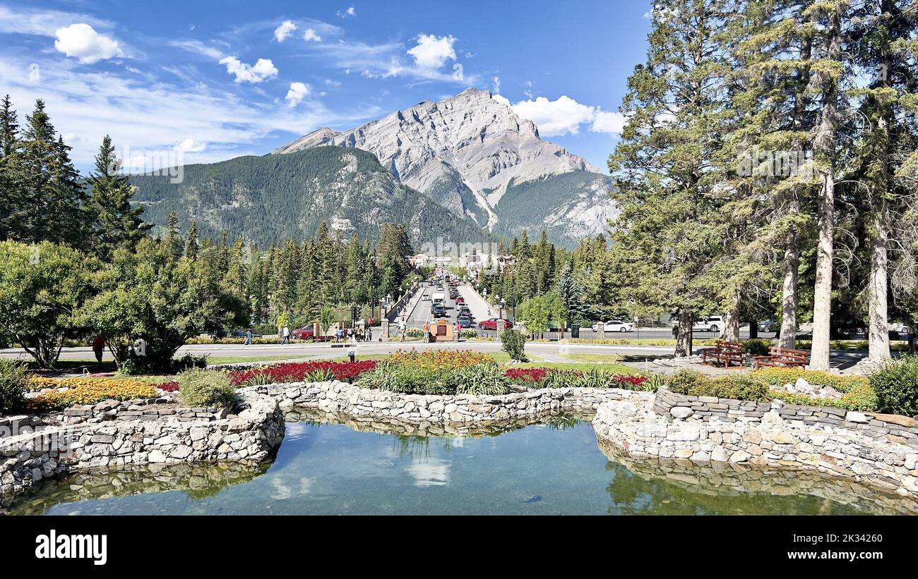 The view of a road and park with Cascade Mountain in the background ...