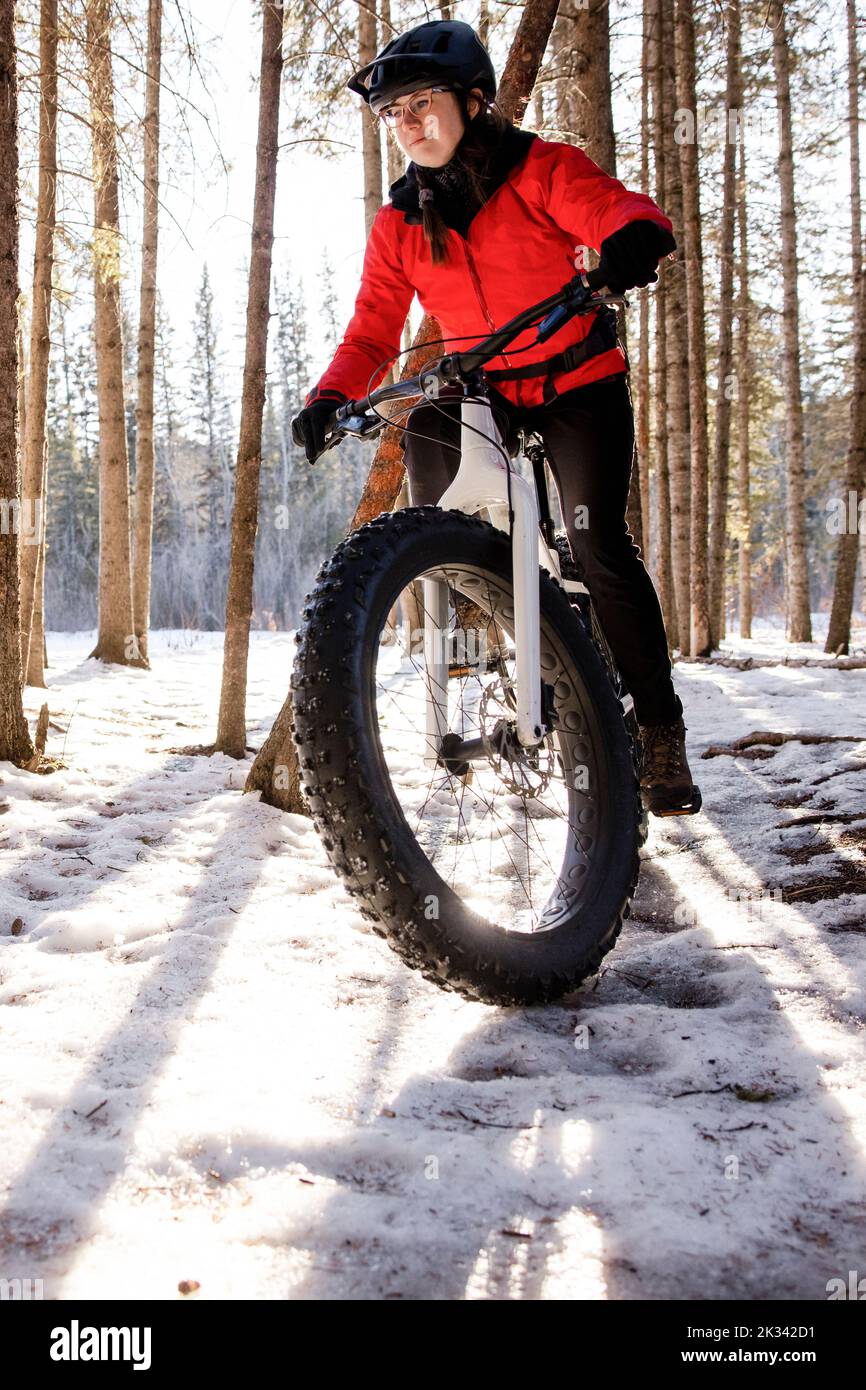 Woman riding bike helmet hi-res stock photography and images - Alamy