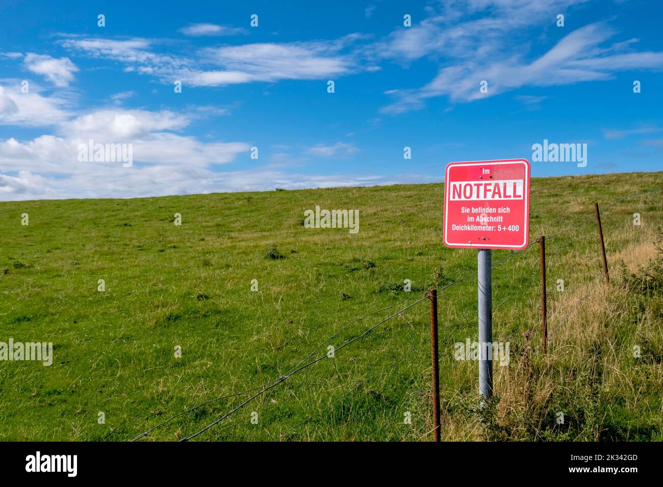 Emergency sign on a dike, North Sea island of Foehr, Schleswig ...