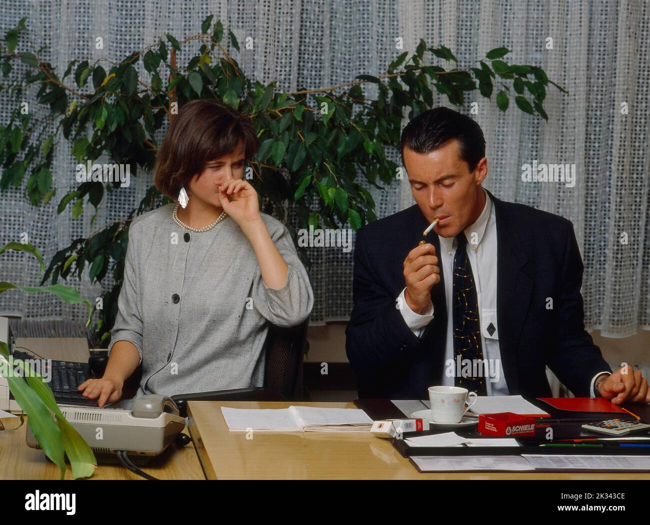 Smoking in the workplace, office scene Stock Photo - Alamy