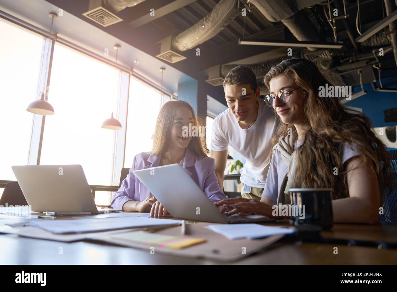 Office specialists are actively working in team on working moments ...