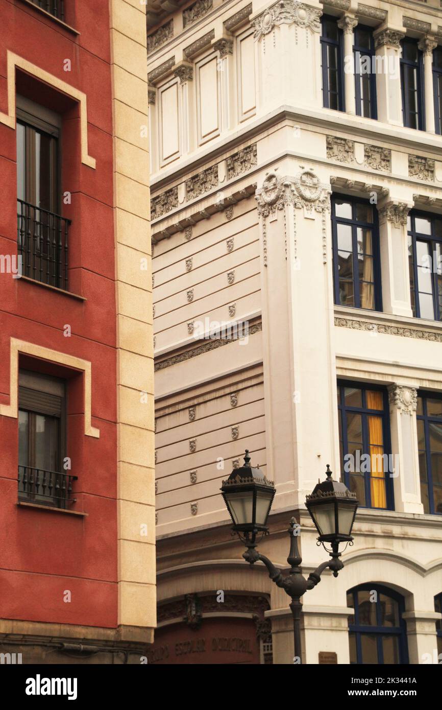 A tall city building and houses Stock Photo - Alamy