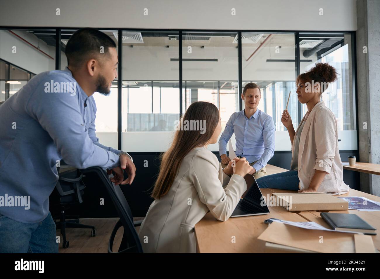 Team of employees participating in brainstorming session Stock Photo ...