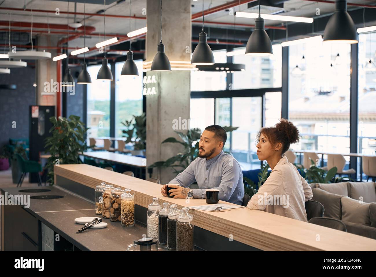 Male and female seated hi-res stock photography and images - Alamy