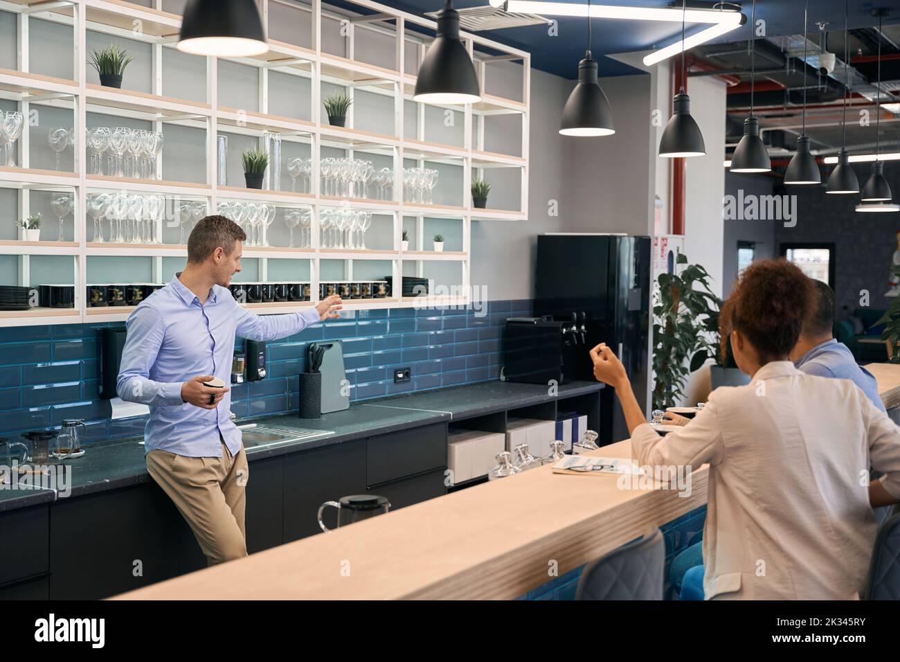 Coworkers inside cafeteria hi-res stock photography and images - Alamy