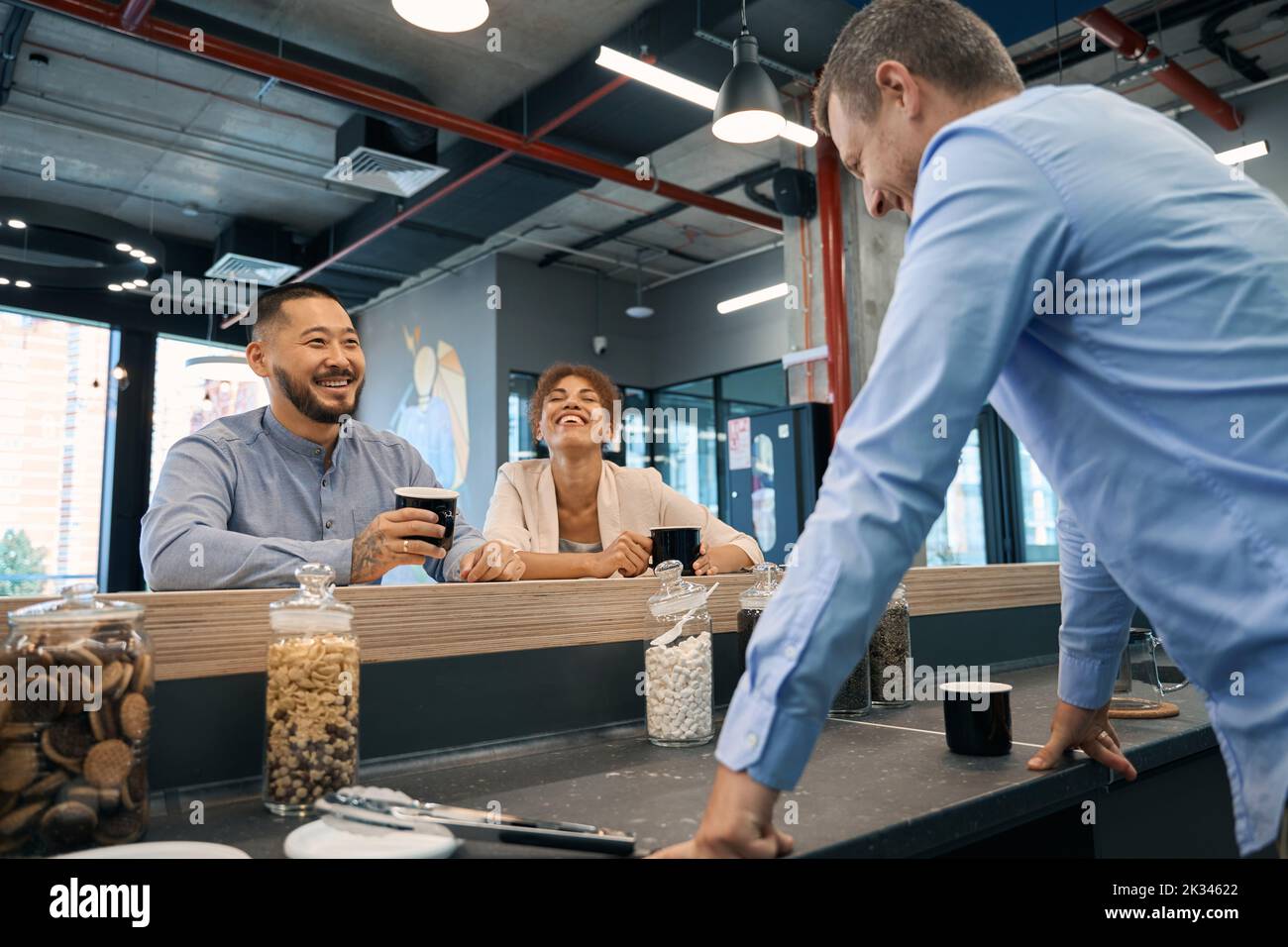 Coworkers inside cafeteria hi-res stock photography and images - Alamy