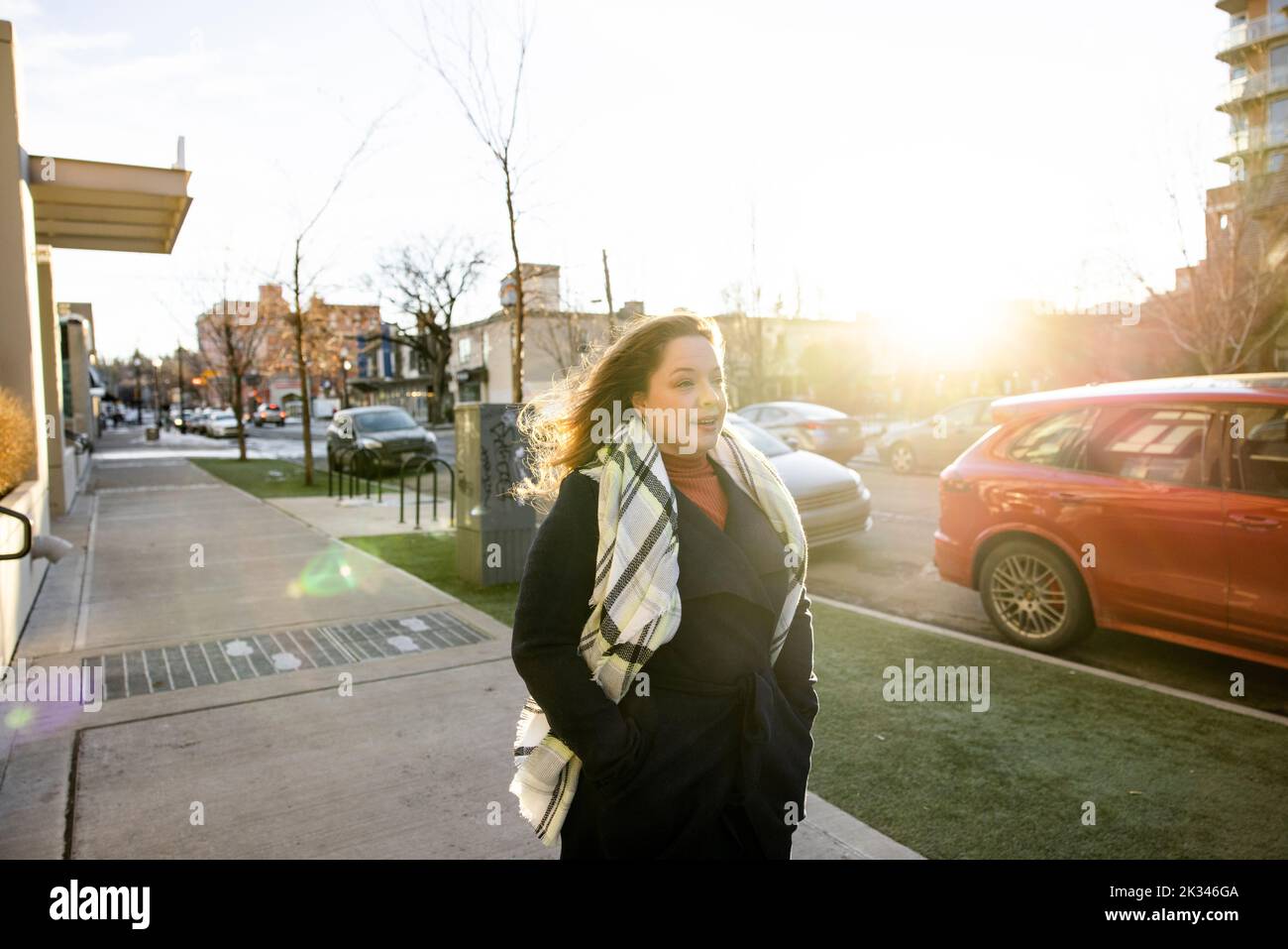 Woman walking coat hi-res stock photography and images - Alamy