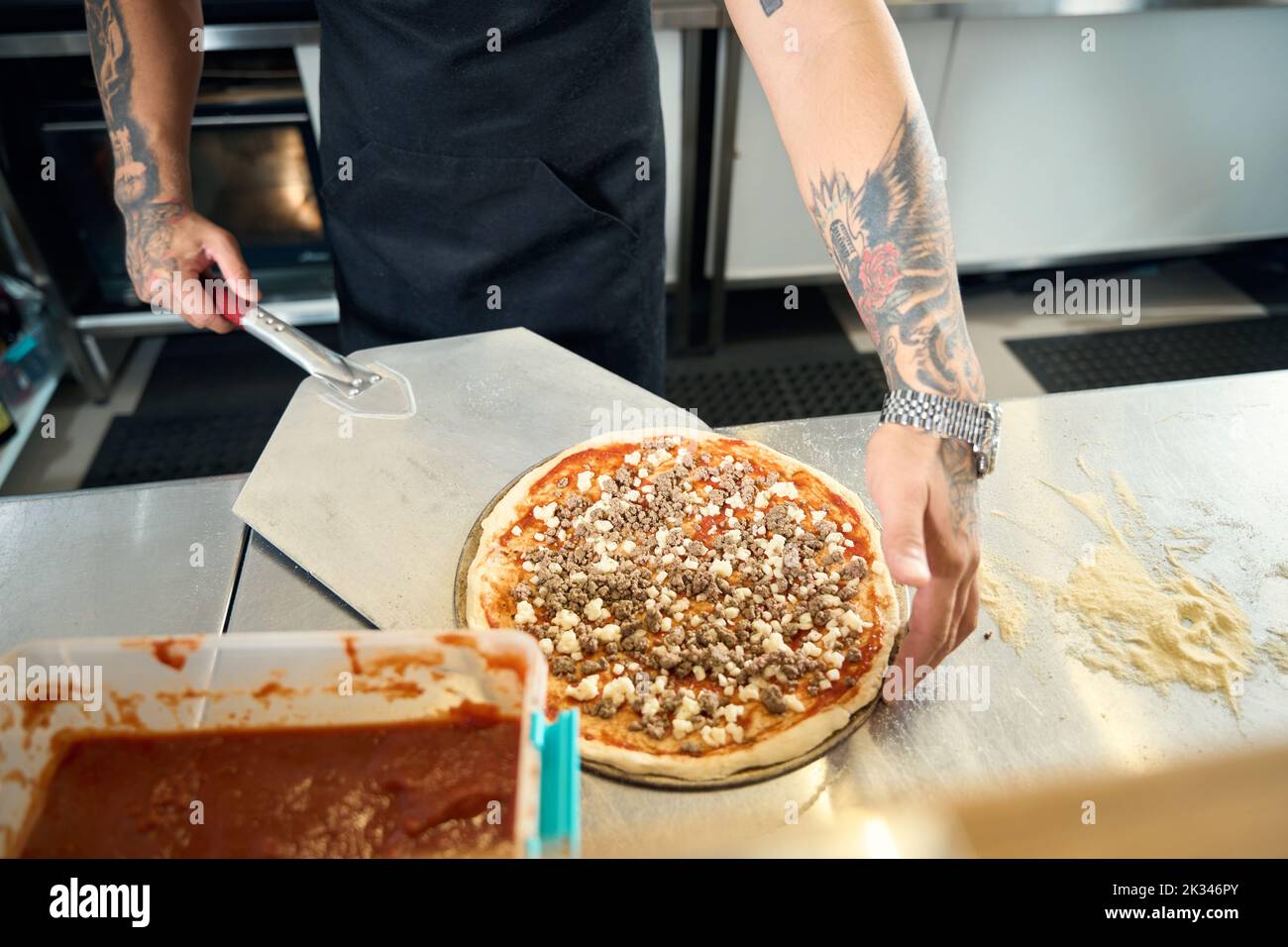 Busy chef working hard while making a delicious pizza Stock Photo - Alamy