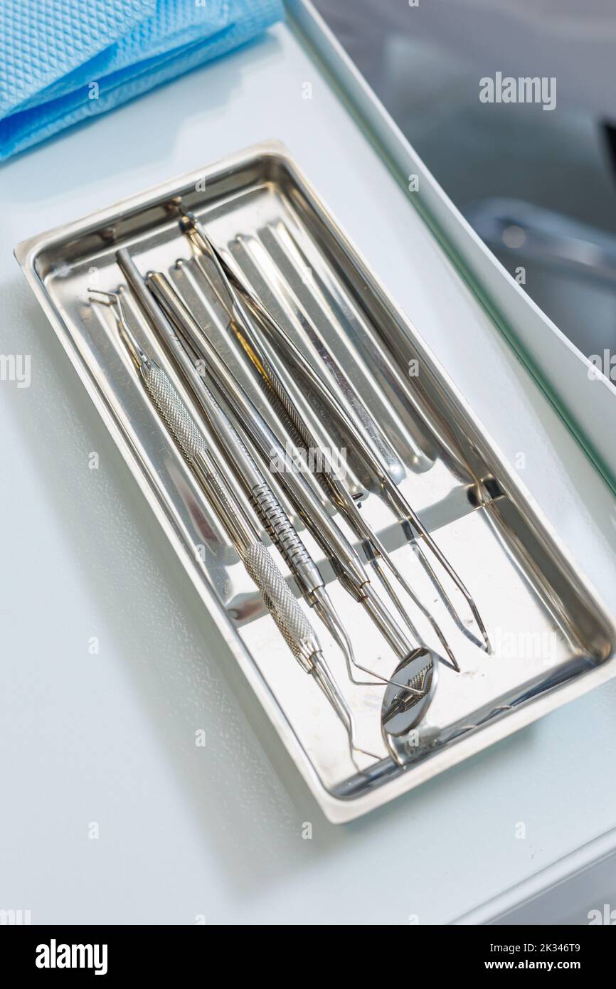 Tray with metal dental tools. Tools of the dentist. Interior of a ...