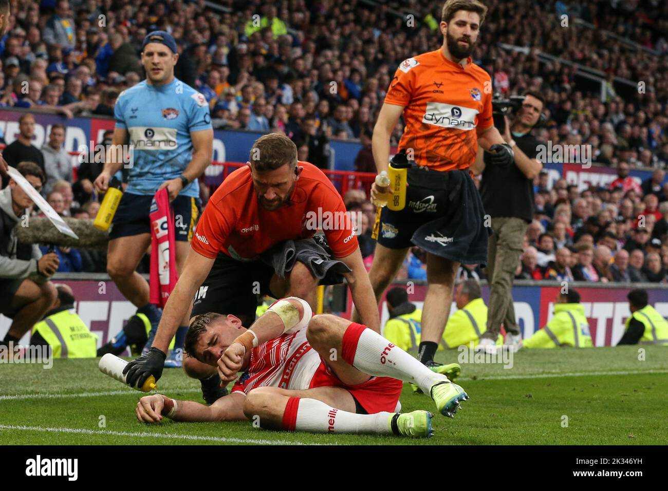 Tommy Makinson #2 of St Helens lies in the ground injured during the ...