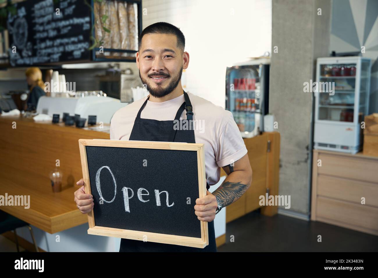 Good-looking guy opening his own business in food industry Stock Photo ...