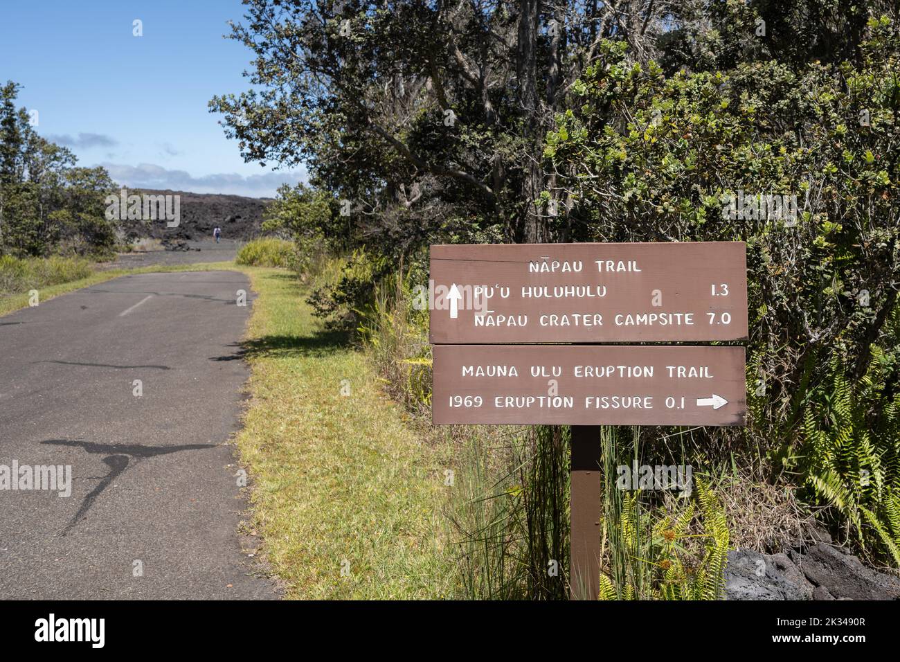 Road sign and road buried by lava rock on Mauna Ulu Eruption Trail ...