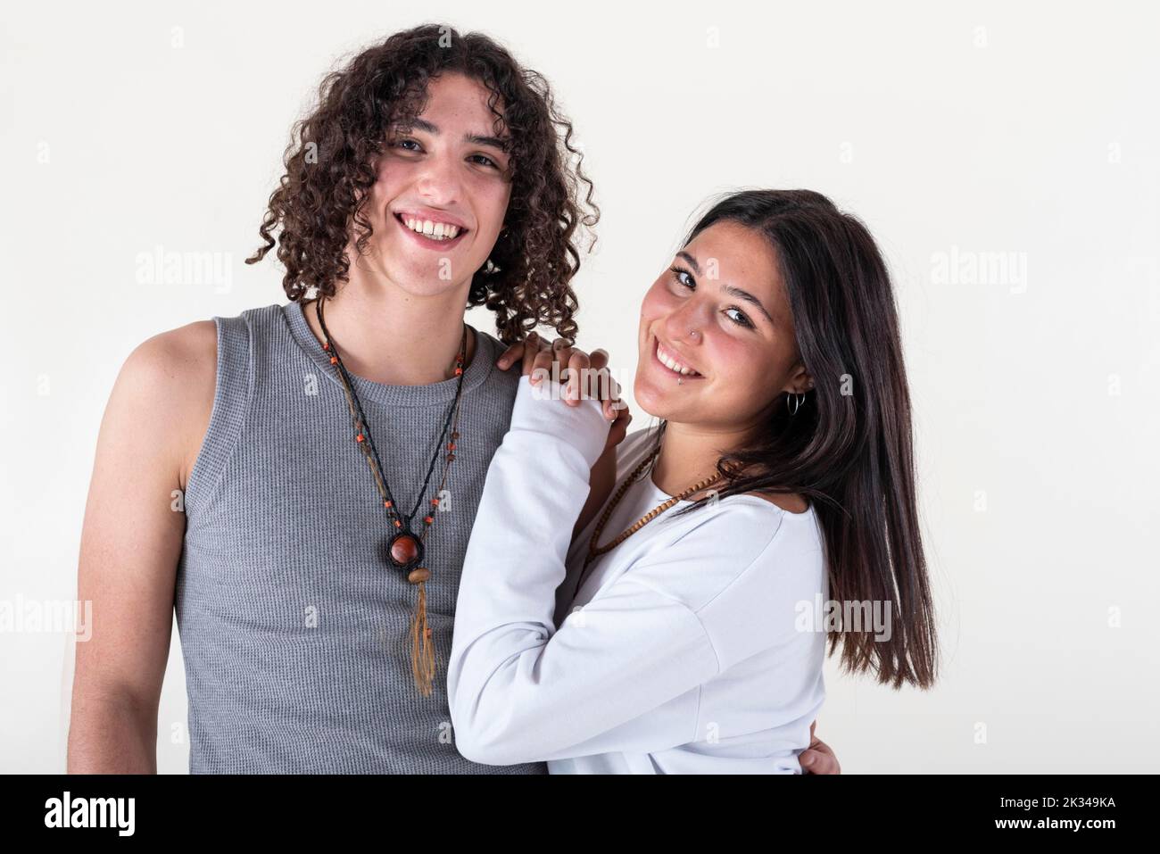 Portrait of a young couple dressed in yoga clothes looking ti the ...