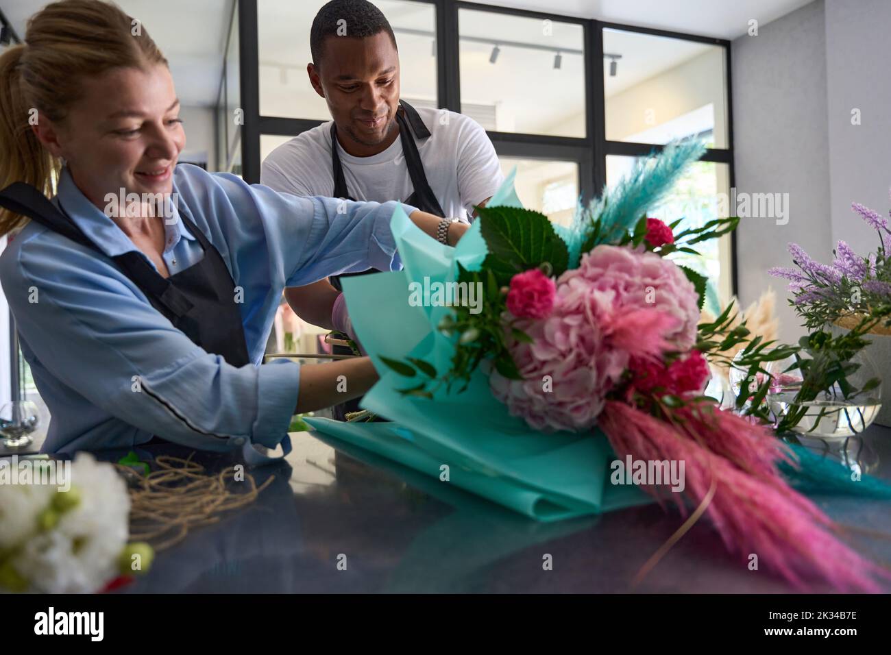 Beautiful bouquet in florists hands hi-res stock photography and images ...