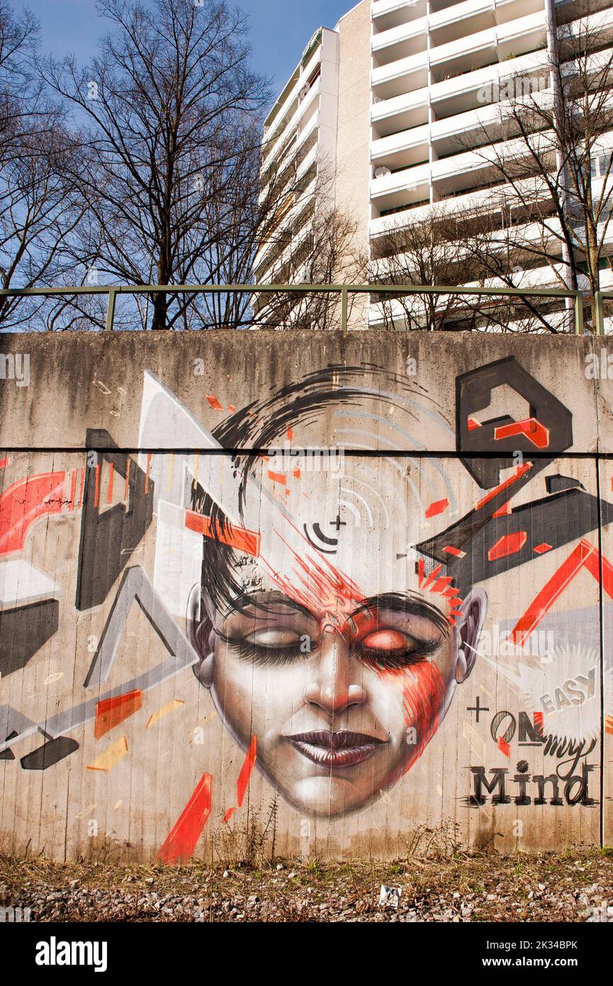 Graffiti woman's face, text: easy on my mind, wall in front of ...