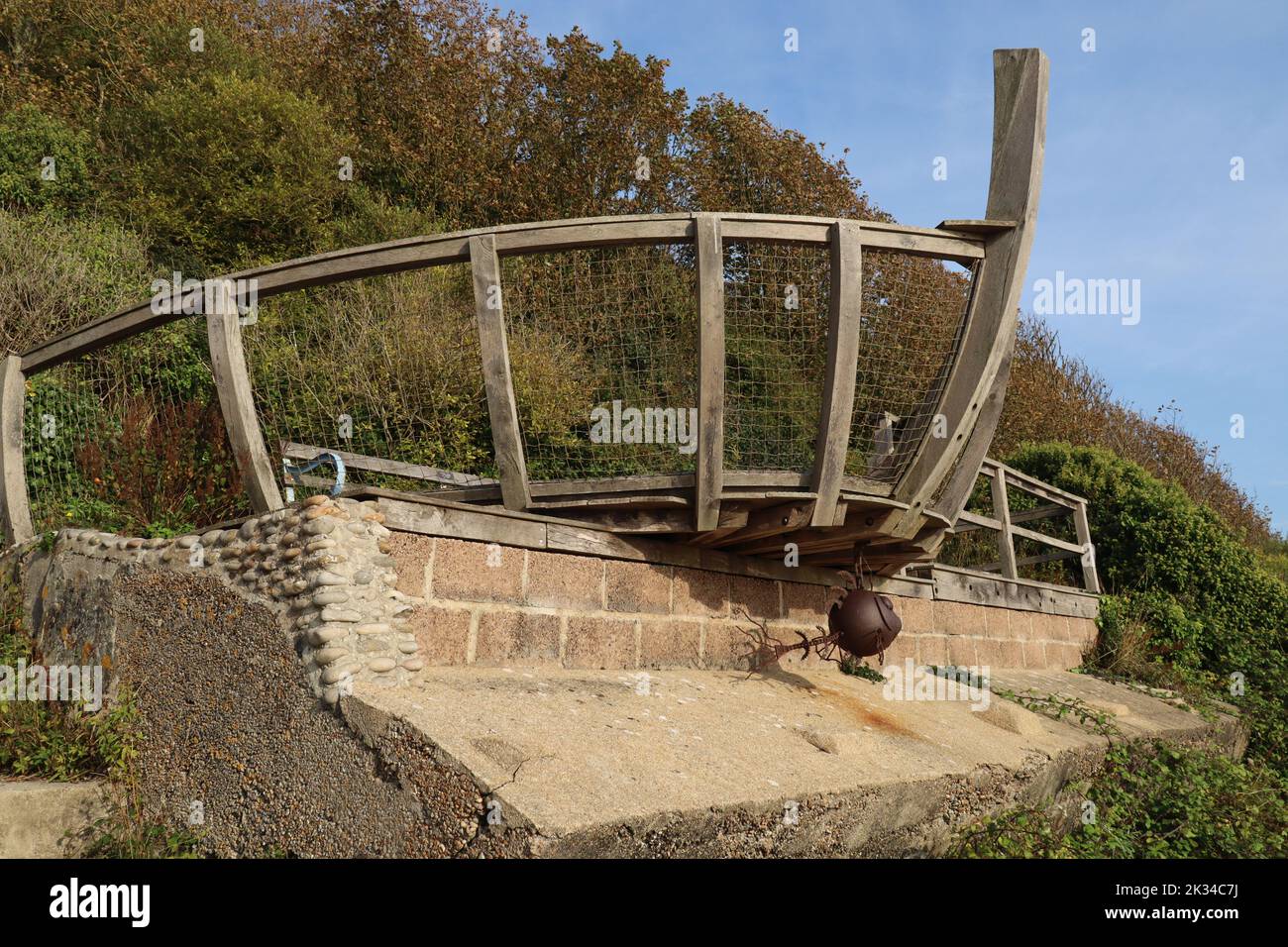 A resting place and viewing point shaped like a boat on the beach at ...