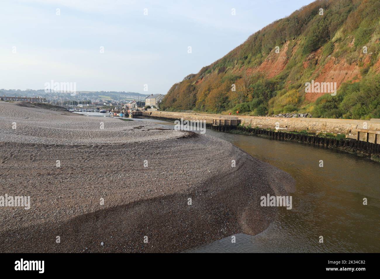 The river Axe near Seaton in Devon curves round a sandbank just before ...