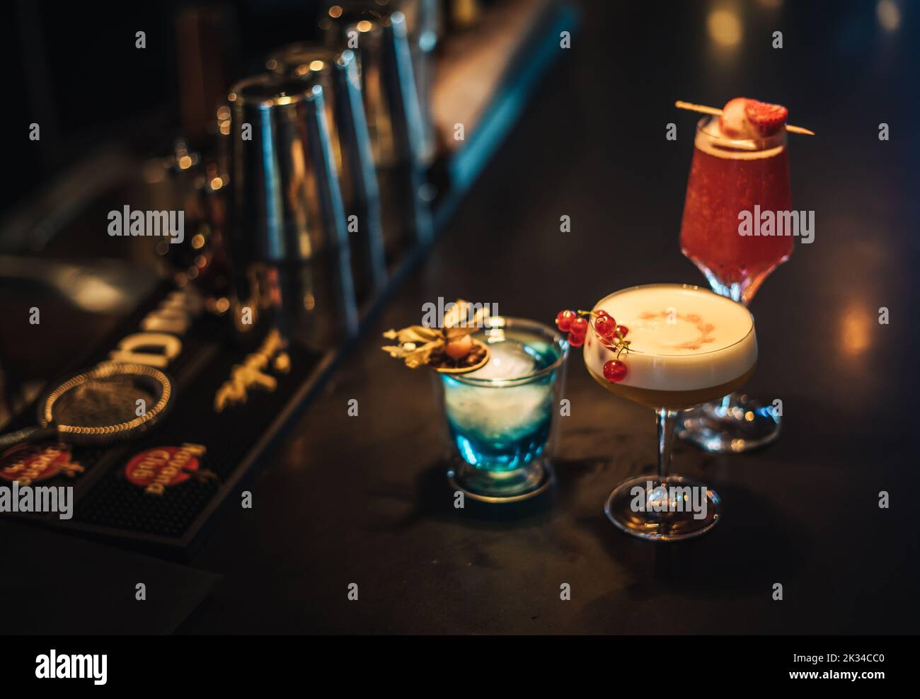 photo of a cocktail shown in a moody cocktail bar without bartender ...