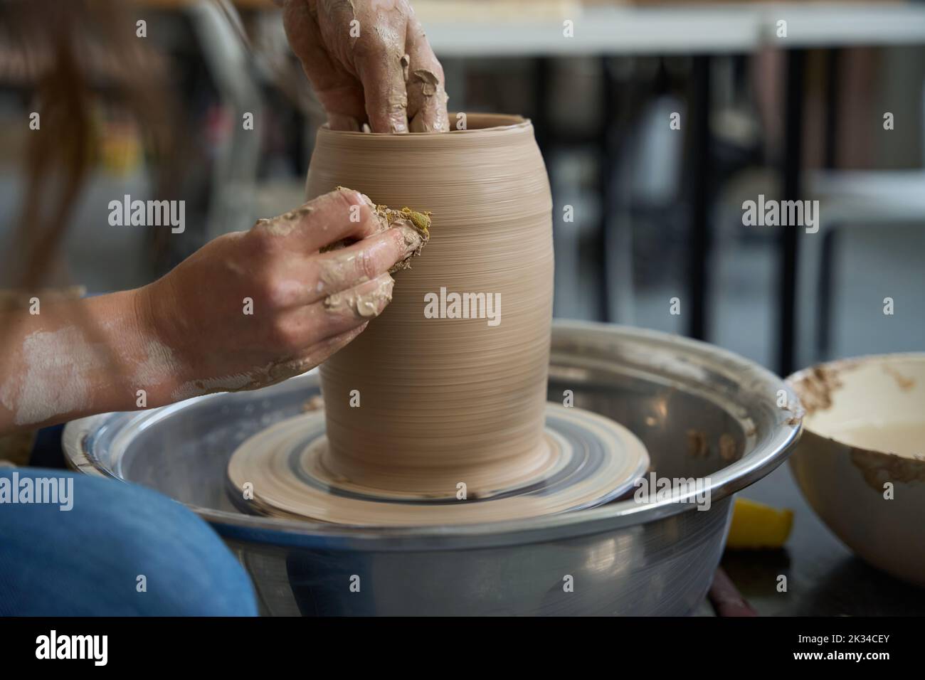 Process of making a clay product on a potter wheel Stock Photo - Alamy