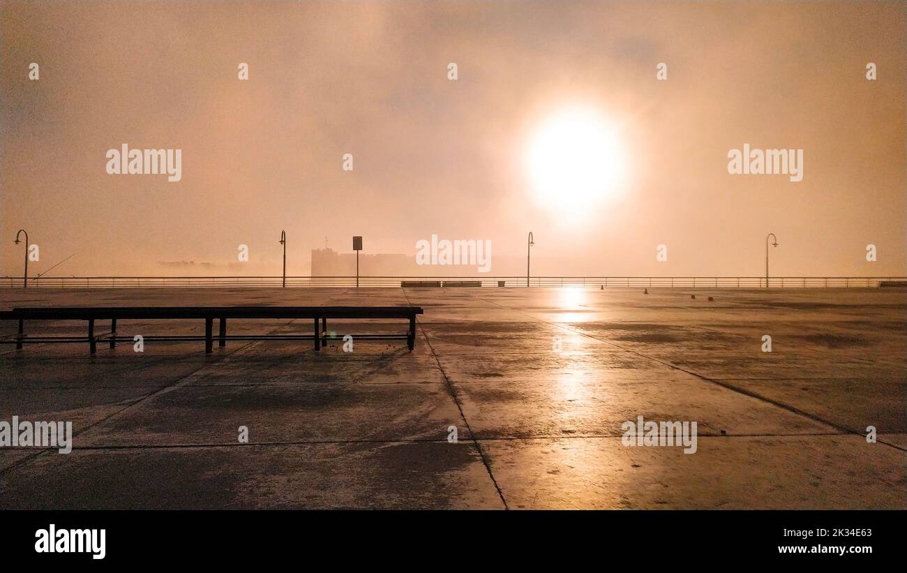 A big cargo ship covered by fog at Parana River, in Rosario, Argentina ...