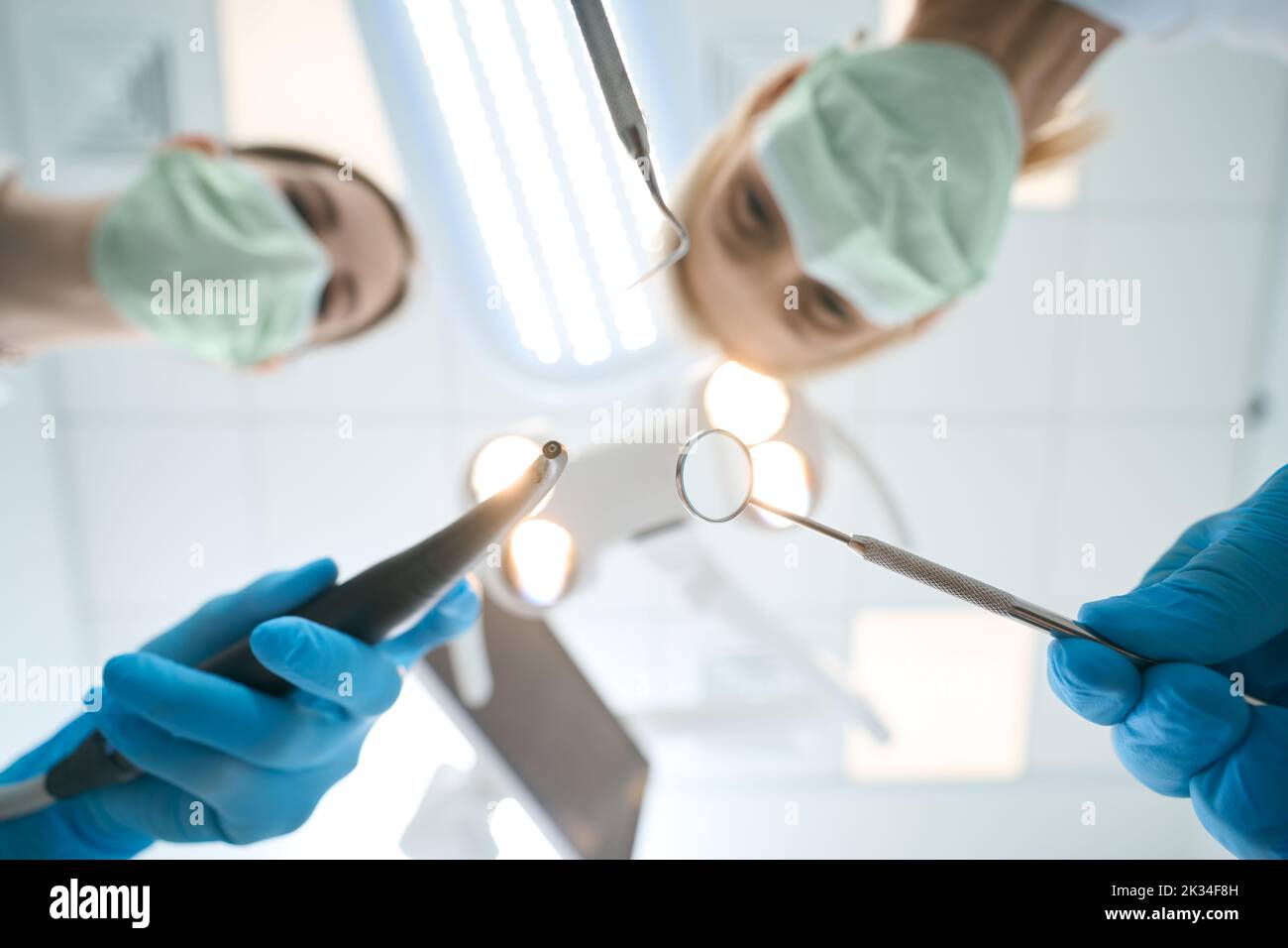 Doctors doing work for patient with toothache Stock Photo - Alamy