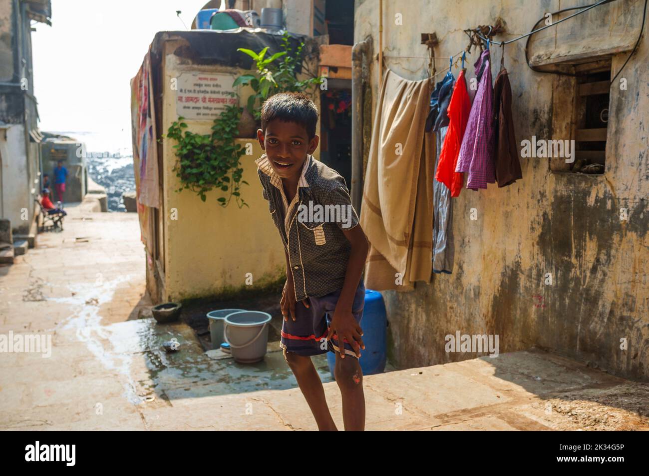 A happy smiling poor Indian boy from Banganga slum in Mumbai, India ...