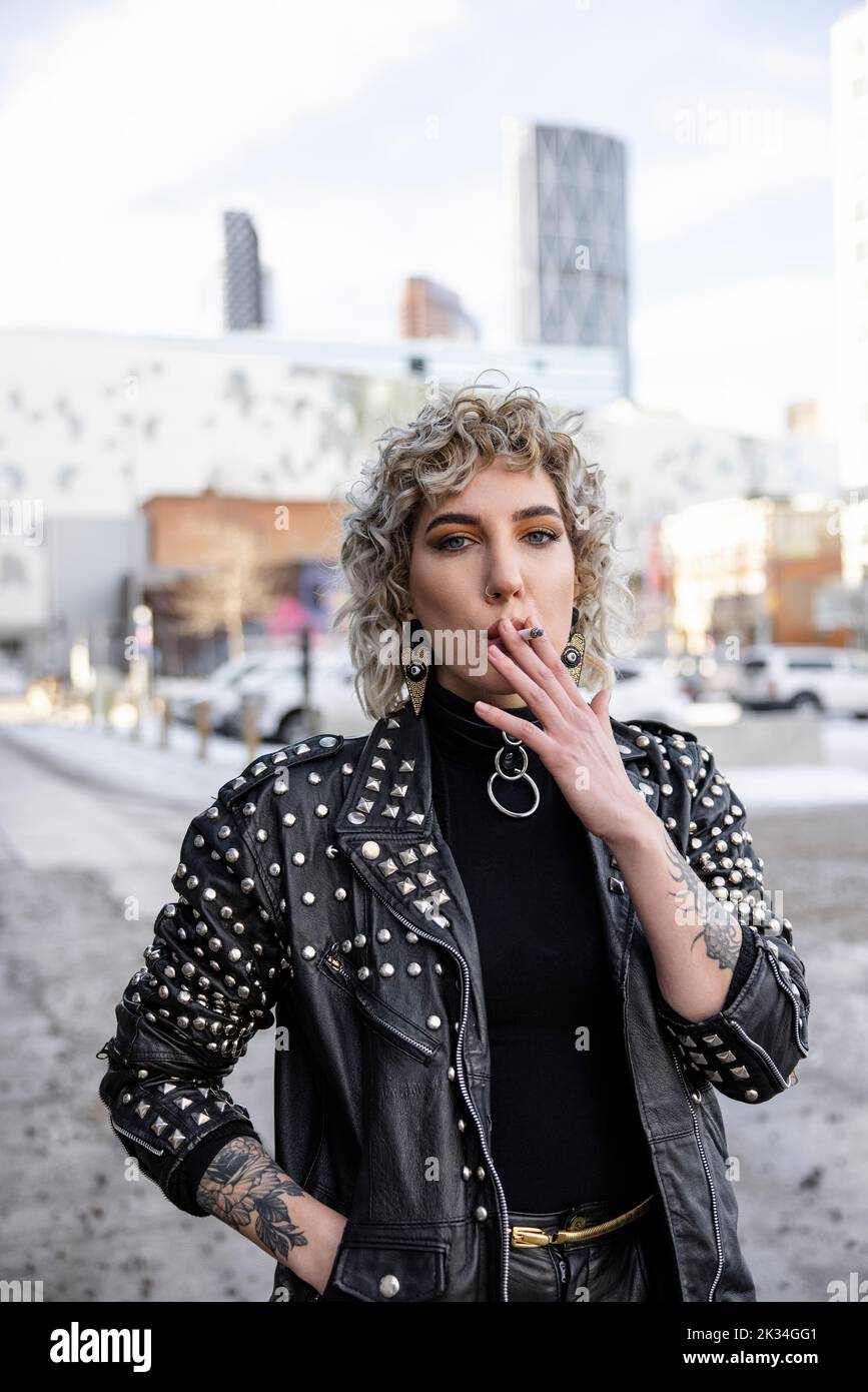 Young blonde woman smoking cigarette hi-res stock photography and ...