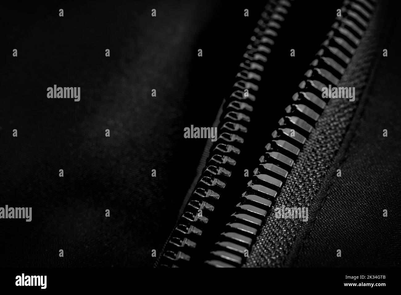 Black lock with a zipper on clothes close-up. Lock Stock Photo - Alamy